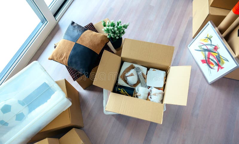 Living Room with Stack of Moving Boxes Stock Image - Image of ...