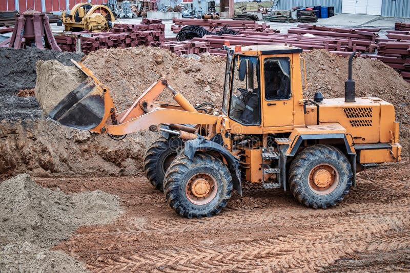 Construction Site Activity with a Heavy Machinery Operating in a Sandy ...