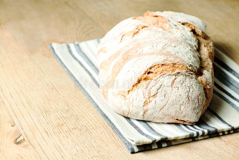 Large Loaf of Bread on Wooden Table Stock Image - Image of sunflower ...