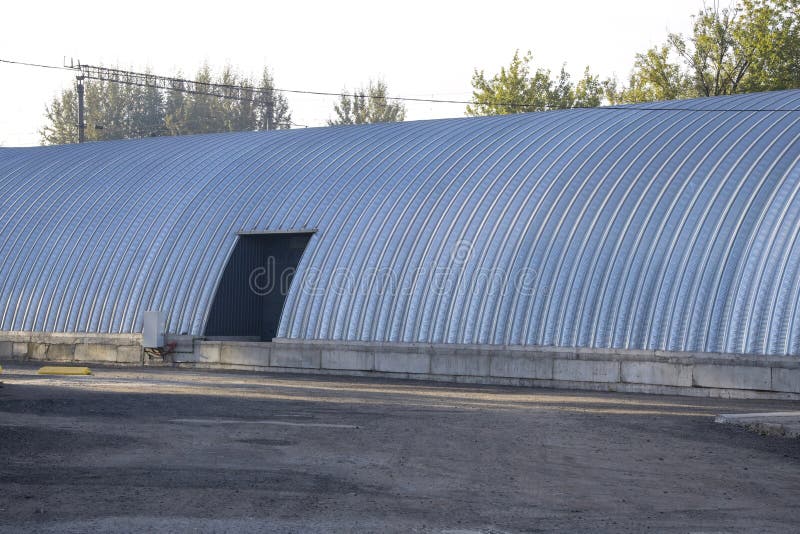Large Long Arched Stainless Steel Hangar with Rolling Gates Stock Photo ...