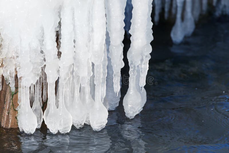 Icicles and a Jet of Water on the Frozen Waterfall Stock Photo - Image ...