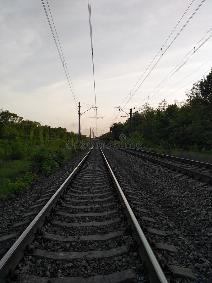 A Large Long Train on a Railroad Track Stock Image - Image of stop ...