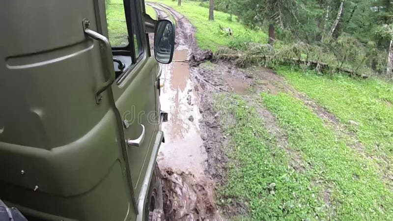 A Large Lorry is Driving through the Mud. Stock Video - Video of tread ...