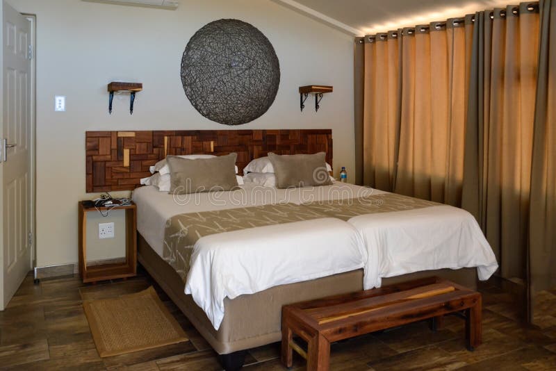 A Large Luxurious Double Bed with Pillows in the Interior of a Hotel ...