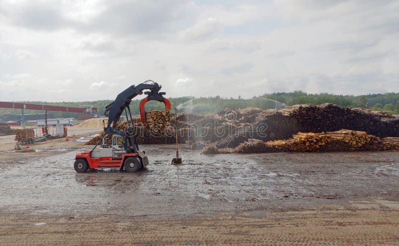 Large Machine Loading Timber at the Pulp and Paper Mill Stock Photo ...