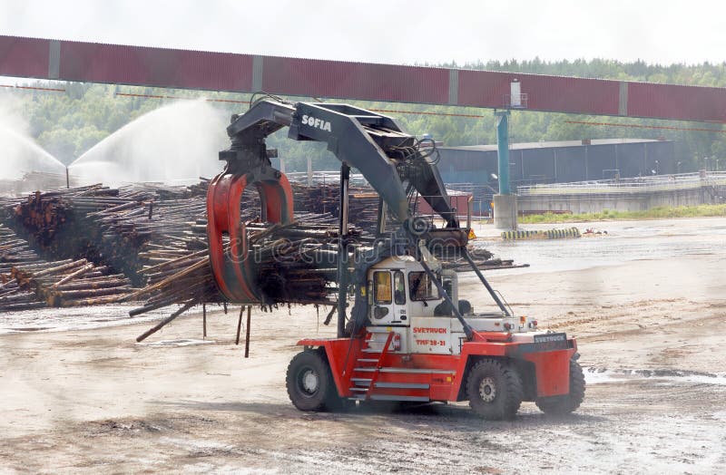 Large Machine Loading Timber at the Pulp and Paper Mill Stock Image ...