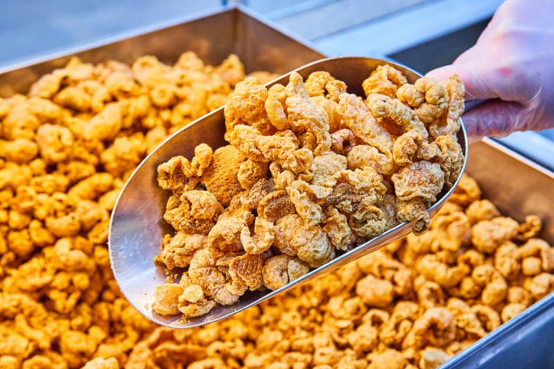 Large Metal Bin of Fresh Chicharrones with Full Pail Stock Photo ...