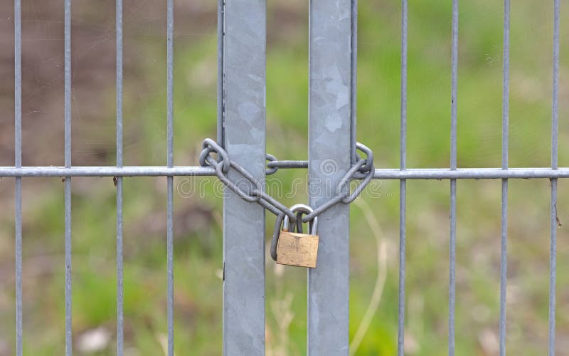Large Metal Fence Locked with a Padlock and a Chain Stock Photo - Image ...