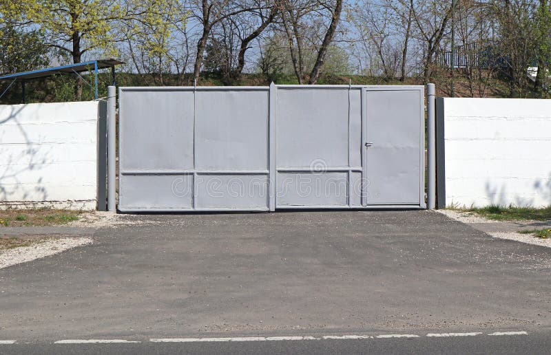 Large Metal Gate at the Industrial Area Stock Photo - Image of white ...