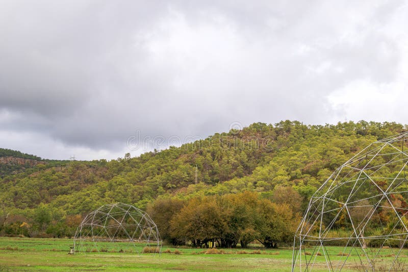 A Large Metal Geodesic Dome Structure in a Rural Setting with Hills in ...