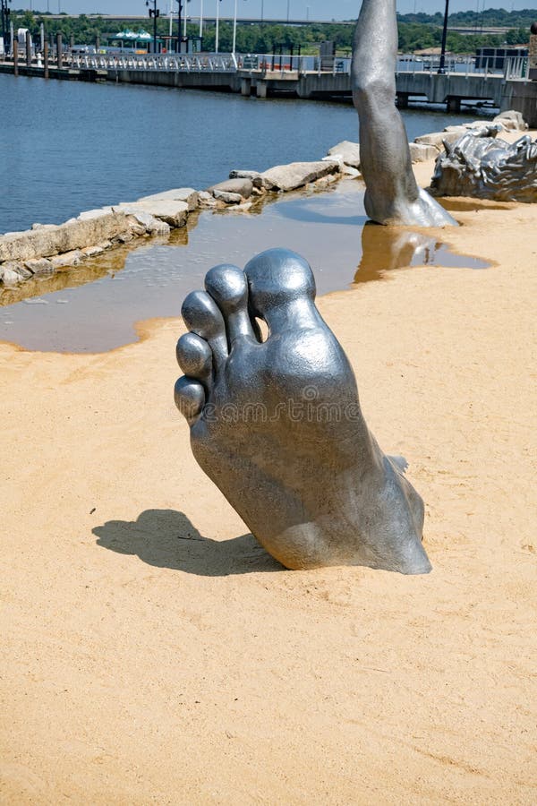Large Metal Leg is Buried in the Sand on the Beach Stock Photo - Image ...