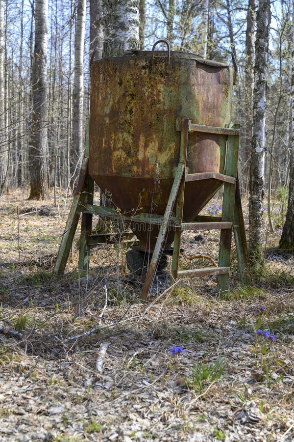 A Large Metal Old Rusty Abandoned Cylinder with a Funnel in the Spring ...
