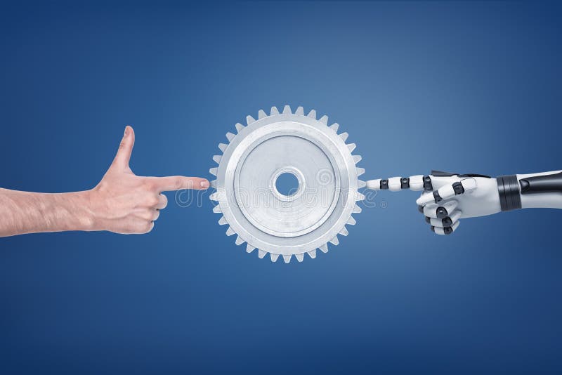 A Large Metal Spur Gear with a Human and a Robotic Hand Touching it ...