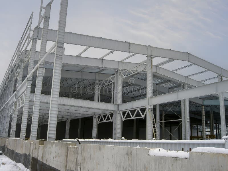 A Large Metal Warehouse Frame Under Construction with Visible Steel ...