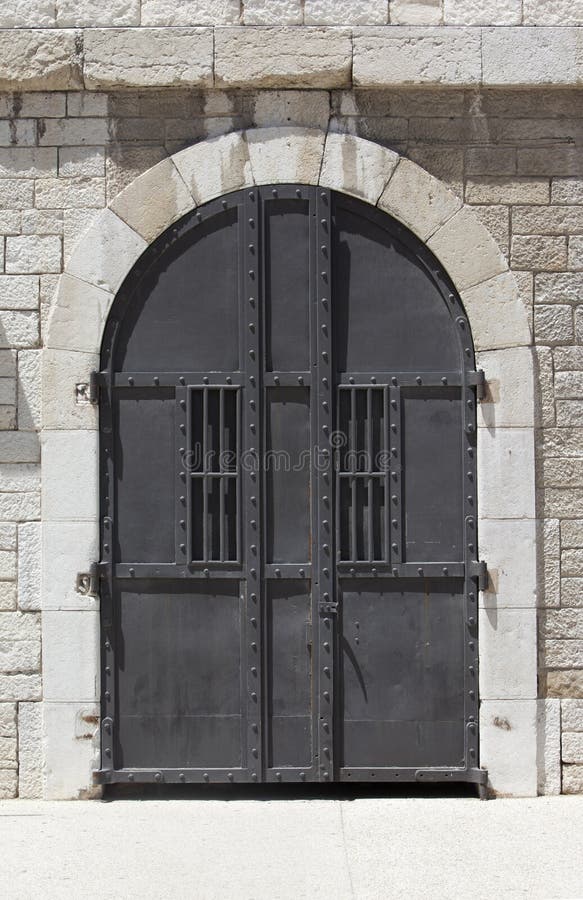 Large Metallic Door And Stone Wall Stock Image - Image of safety ...