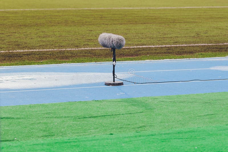 A Large Microphone Boom with Windshield for TV or Radio Situated at the ...