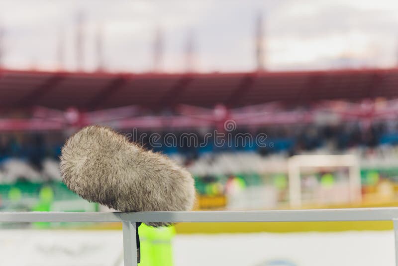 A Microphone on the Ground and Blurred Photo of Conference Hall or ...