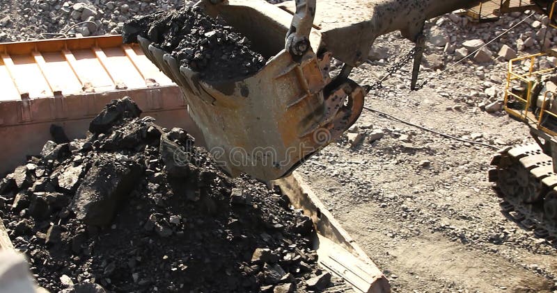 Bucket of a Mining Excavator Close-up. Loading Iron Ore into a Mining ...