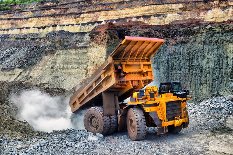 Large Mining Loader Unloads Extracted Ore or Rock. Stock Image - Image ...