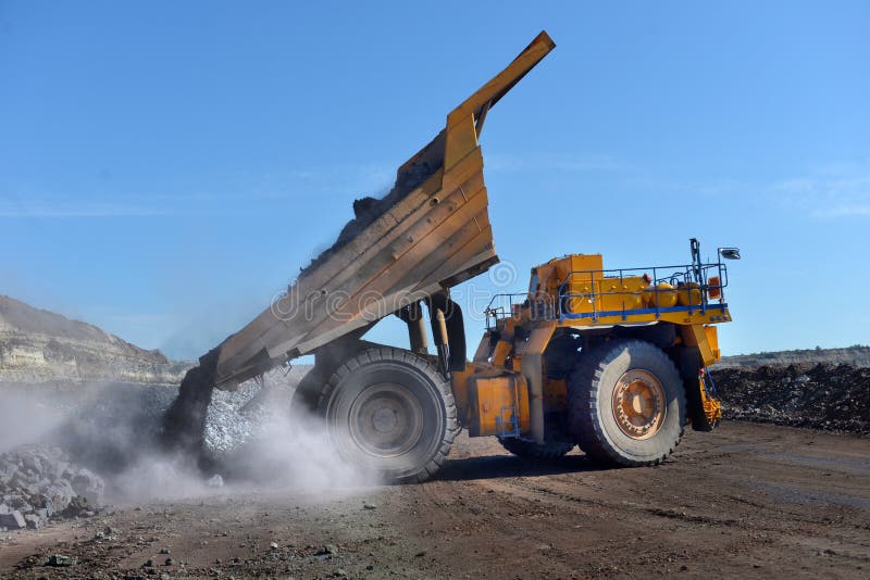 Large Mining Loader Unloads Extracted Ore or Rock. View from the Stock ...