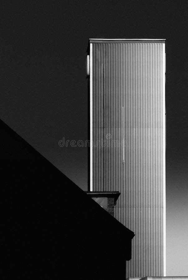 Large Modern Building on the Background of the Sky in Grayscale Stock ...