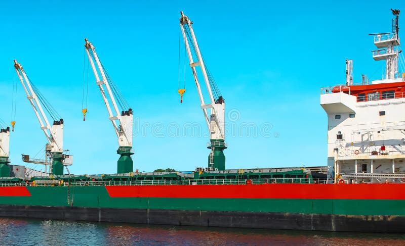 Cargo Ship at Seaport for Loading and Unloading. Green Hull with Red ...
