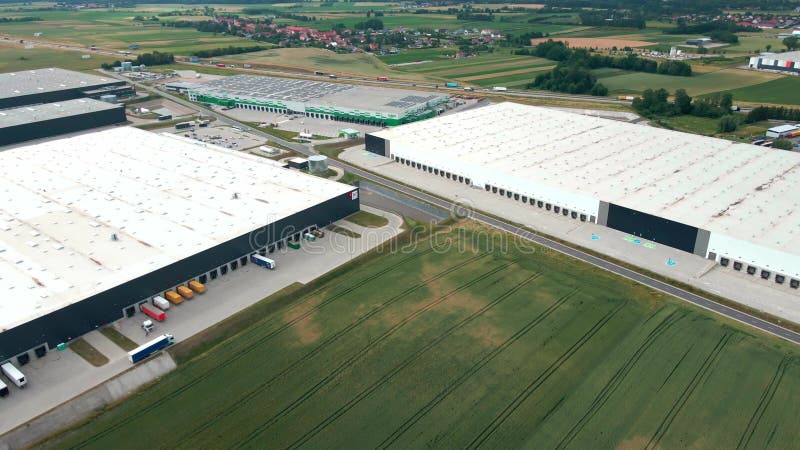 Large Modern Warehouse with Loading Docks in Green Rural Landscape ...