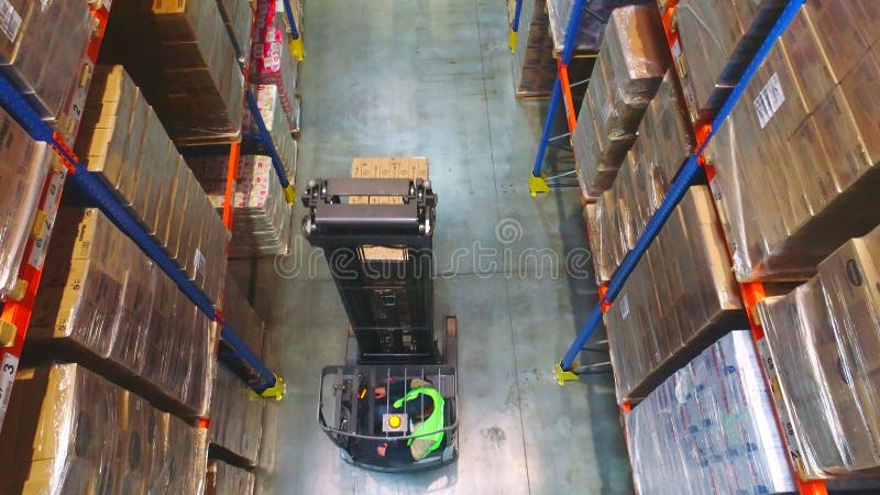 Warehouse Work. Modern Loaders in a Large Warehouse. Special Equipment ...