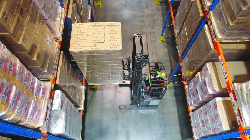Warehouse Work. Workflow in a Large Warehouse. Special Equipment in the ...