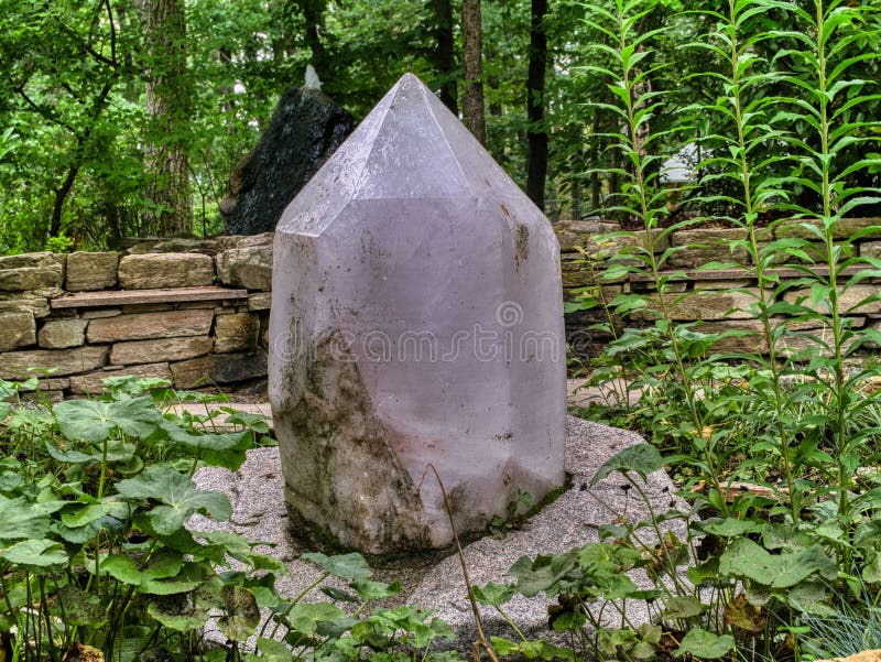 Large Mountain Crystal Stone in a Garden Setting Stock Image - Image of ...