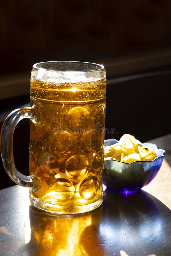 Large Mug of Beer and Chips on a Wooden Table Stock Photo - Image of ...
