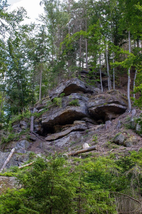 Large Multi-layered Rocks on the Background of Green Trees Stock Image ...