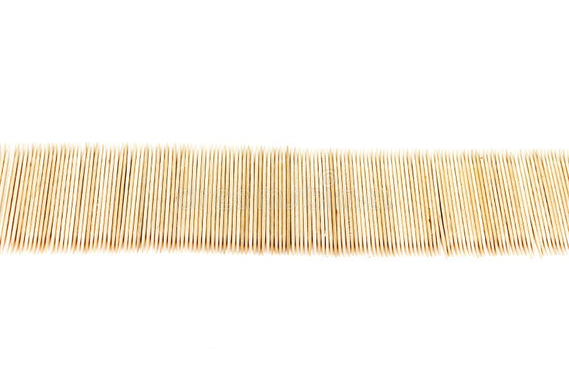 Large Number of Toothpicks Lined Up in a Long Row, Isolated on White ...