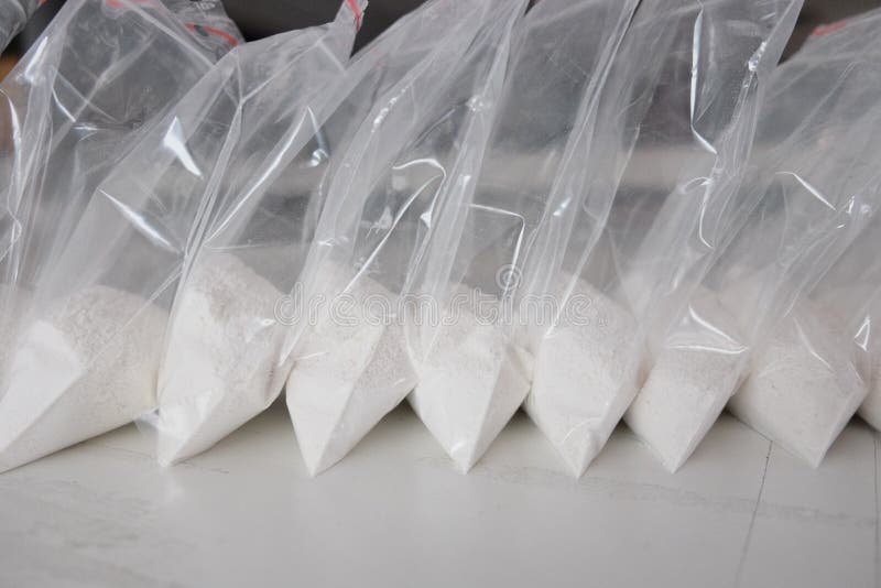 A Large Number of Transparent Sachets Filled with White Powder. White ...