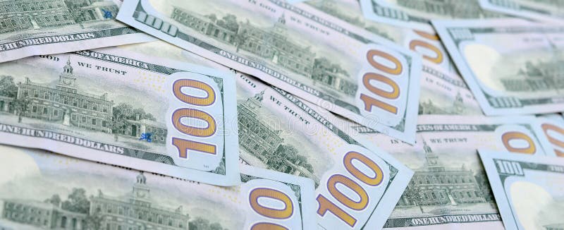 A Large Number of US Dollar Bills of a New Design with a Blue Stripe in ...