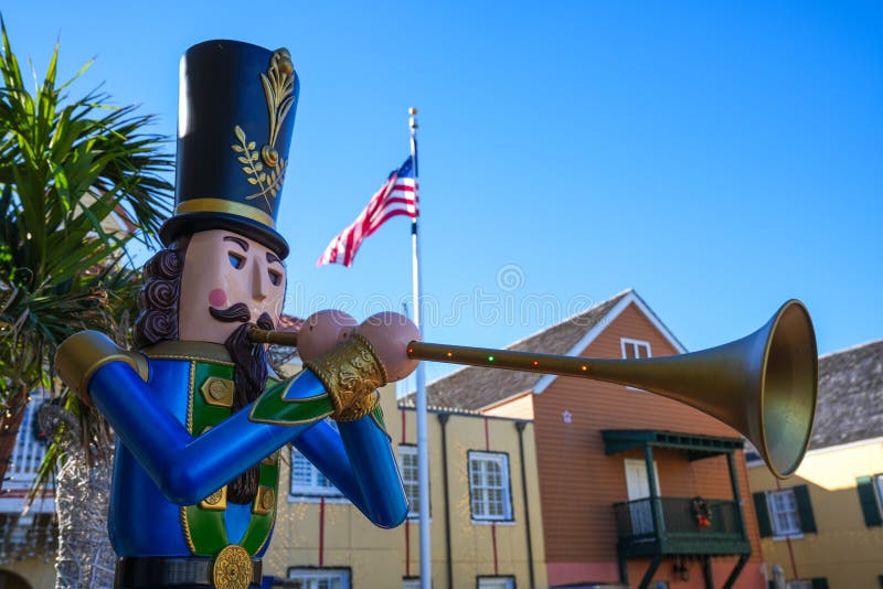 Large Nutcracker Statue with a Trumpet Against a Blue Sky Stock Photo ...