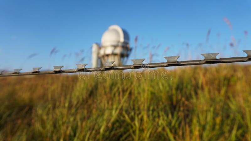 A Large Observatory is Protected by a Barbed Fence Stock Image - Image ...