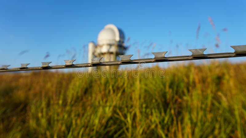 A Large Observatory is Protected by a Barbed Fence Stock Image - Image ...