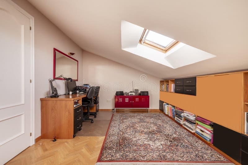 A Large Office Inside a Room with Sloping Ceilings Stock Image - Image ...