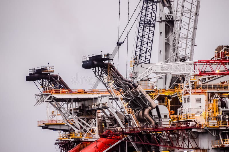 A Large Oil Rig with a Crane on Top Stock Photo - Image of lifting ...
