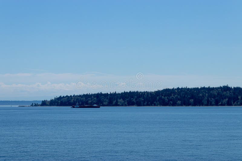 Large Old Barge Floating Along the Shoreline of Washington State Stock ...
