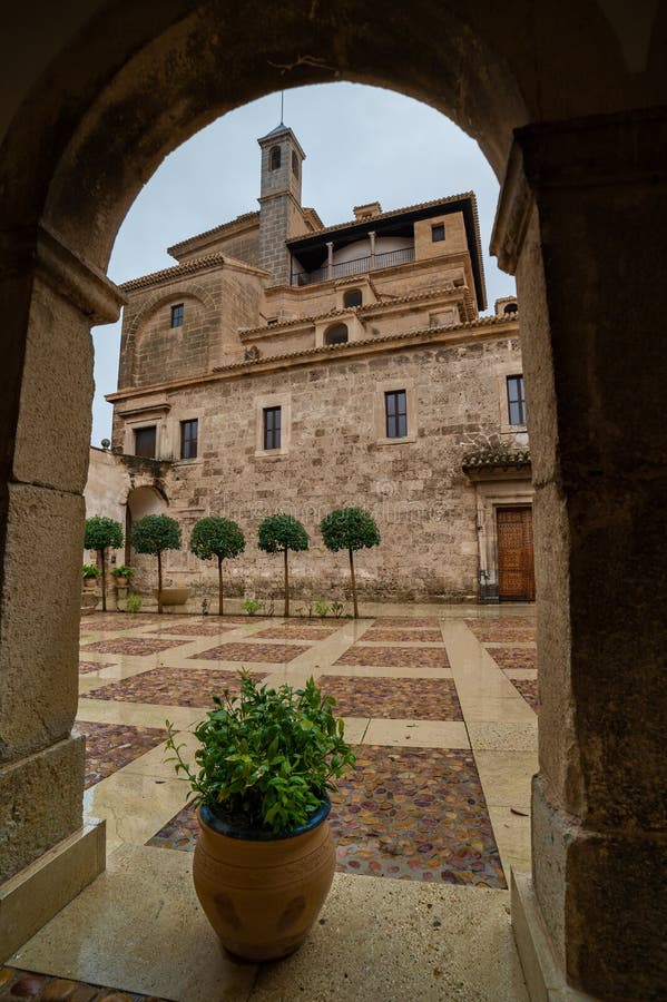 A Large Old Building Seen through an Arch Stock Photo - Image of ...