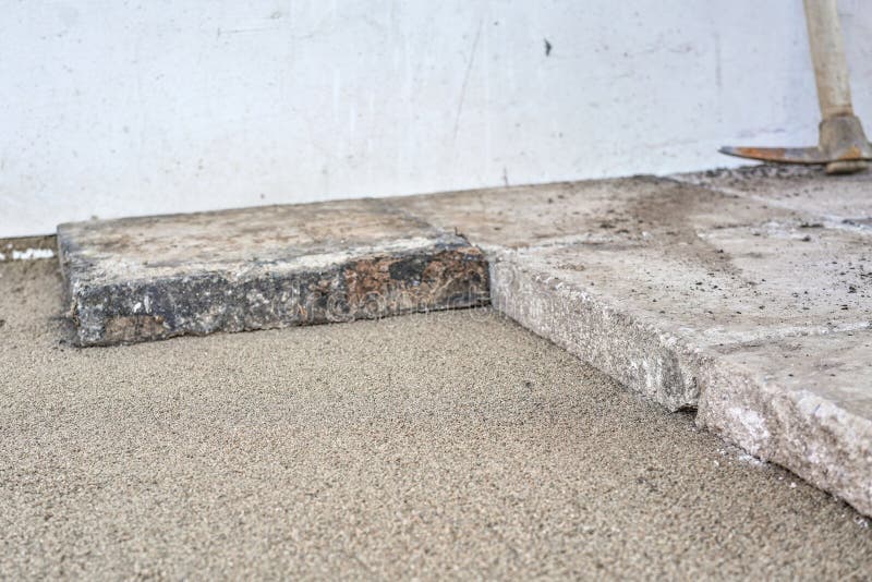 Large Old Concrete Tile Blocks on Layer of Sand - Pavement Construction ...