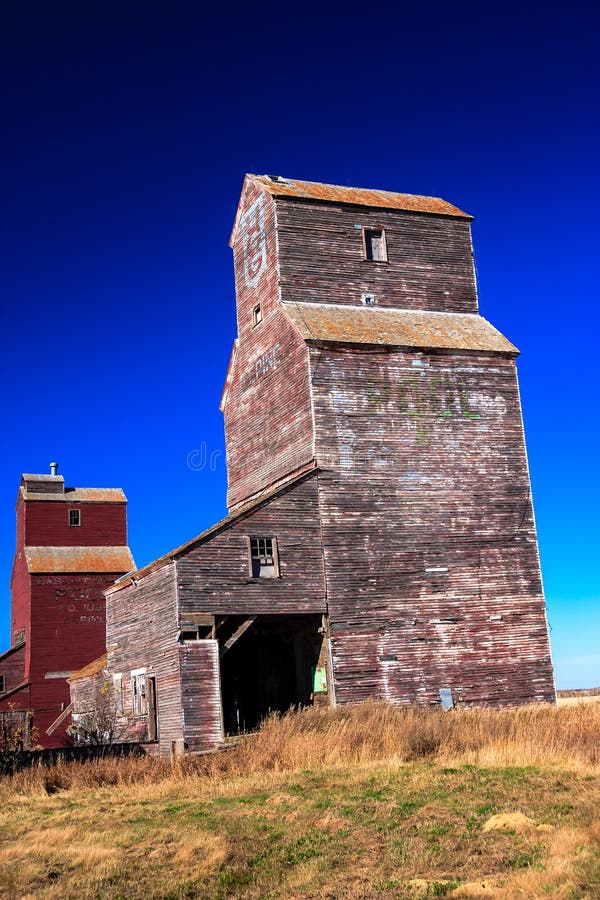 A Large, Old Grain Silo is Surrounded by a Field Stock Image - Image of ...