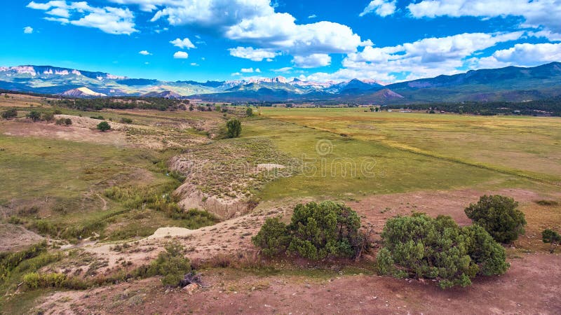 Large Open Desert Field with Mountain Range in Background Stock Image ...