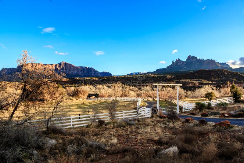 A Large, Open Field with a White Fence and a Gate Stock Image - Image ...