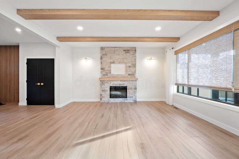Large Open Living Room with a Fireplace and a Window Stock Photo ...