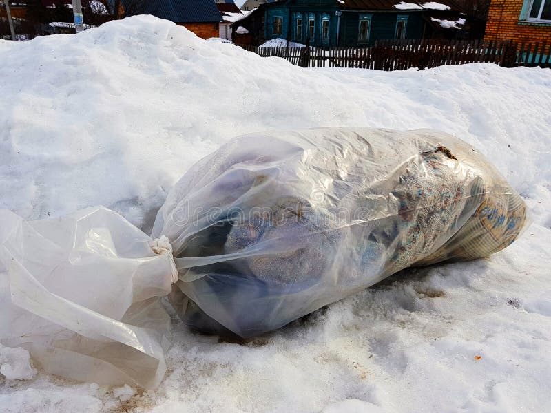 A Large Package of Garbage Lies Right on the Road Against the Backdrop ...