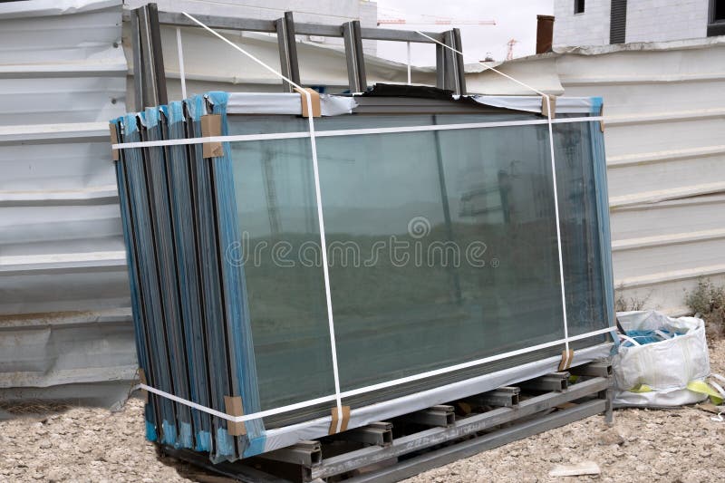 Package of New Glass Windows on the Construction Site. Stock Photo ...
