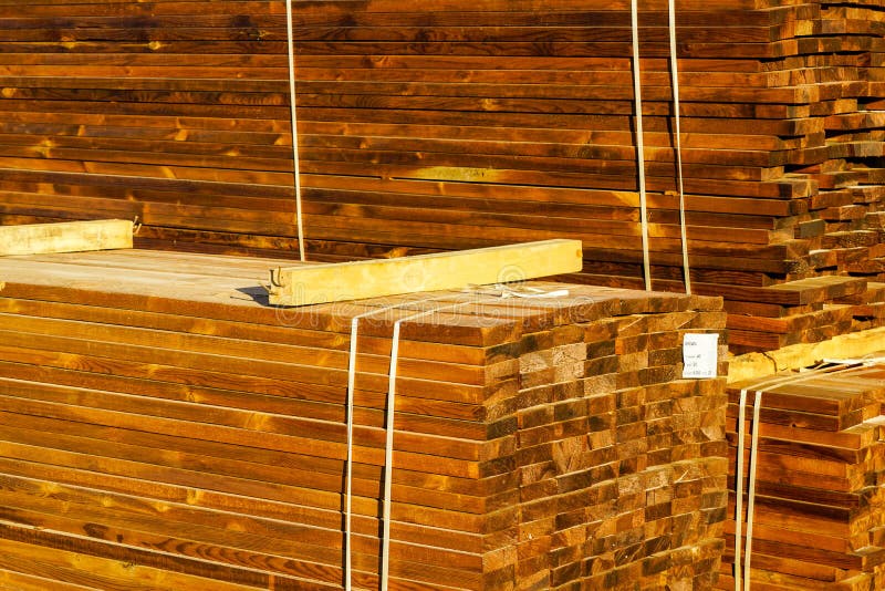 Large Packs of Brown Tinted Pine Boards Stock Photo - Image of planed ...
